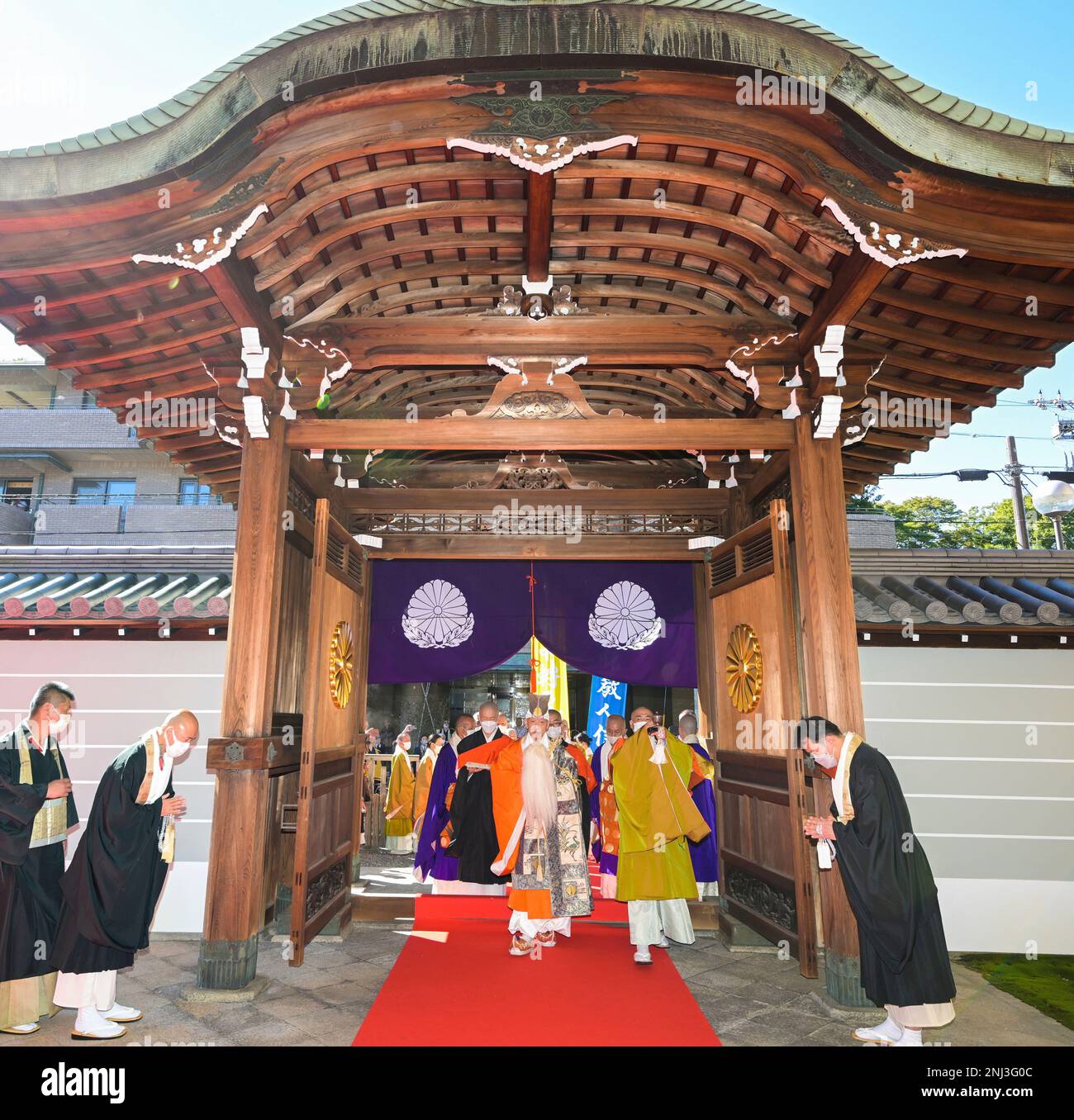 Jitsuo Iida (C), head of a Buddhist sect walks at Chokumon Gate of ...