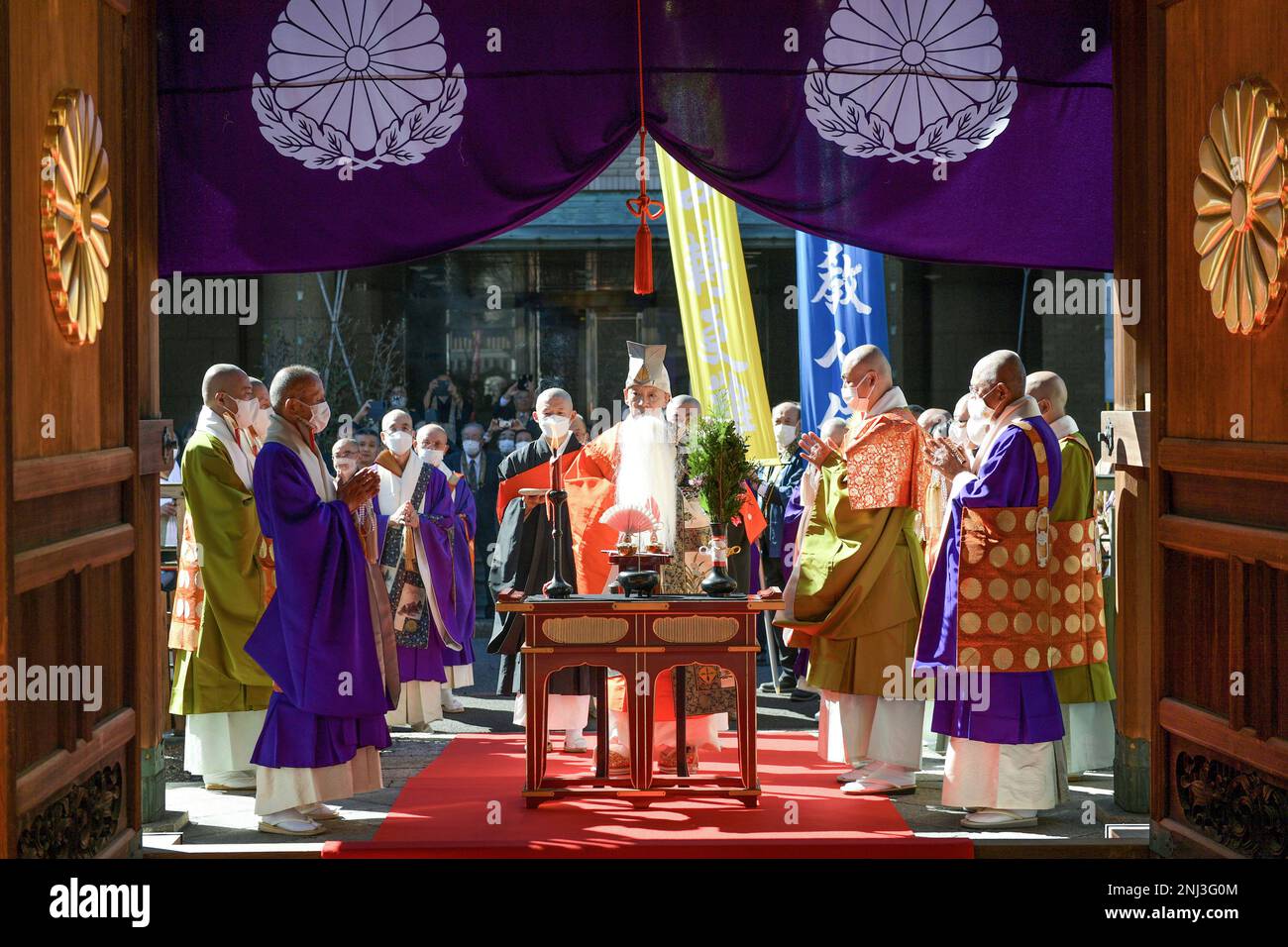 Jitsuo Iida (C), head of a Buddhist sect walks at Chokumon Gate of ...