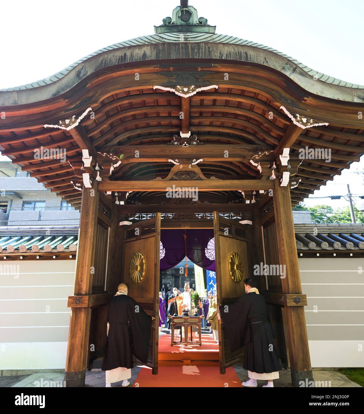 Jitsuo Iida (C), head of a Buddhist sect walks at Chokumon Gate of ...