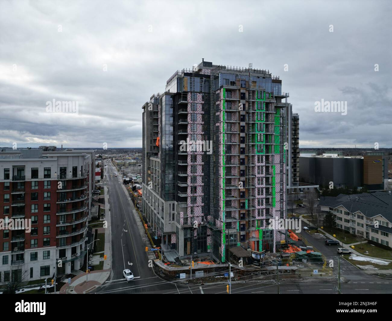 An aerial view of a large, multi-story building under construction ...