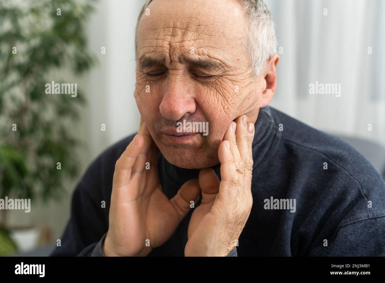 Old man with toothache. Elderly senior man has toothache. Unhappy man ...