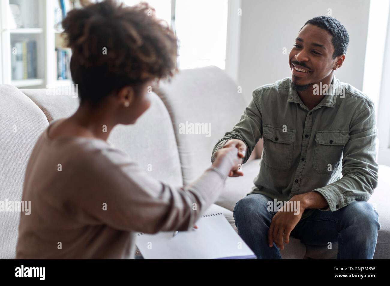 Happy Black Man Handshaking With Psychologist After Therapy Session ...
