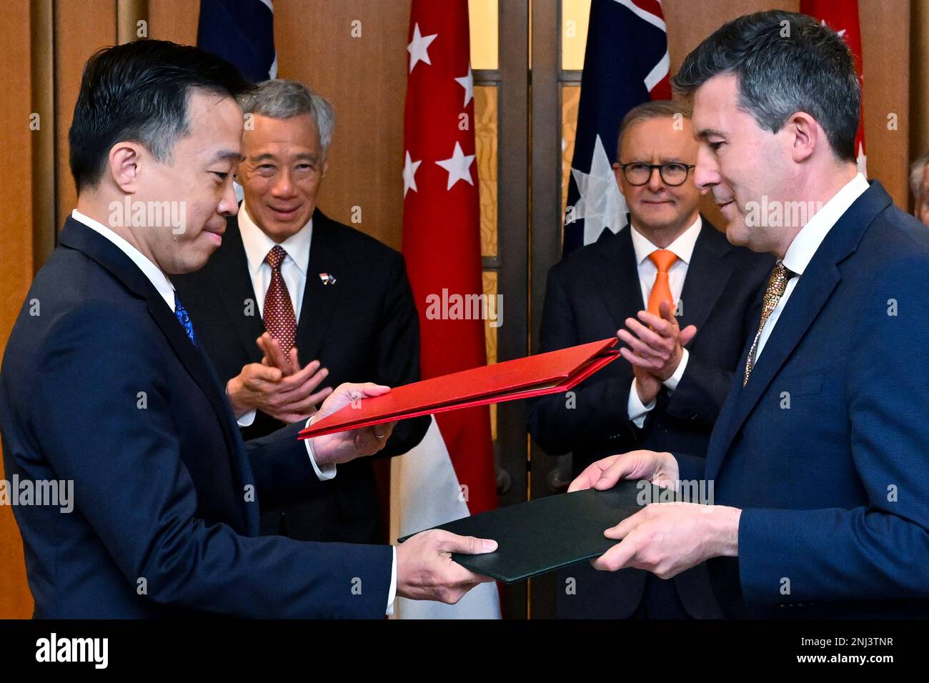 Prime Minister of Singapore Lee Hsien Loong, second left, and ...