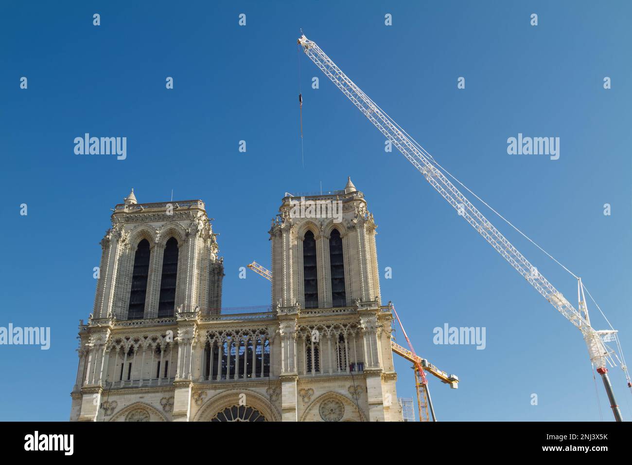Notre Dame Cathedral Surrounded By Cranes During Renovation Work After