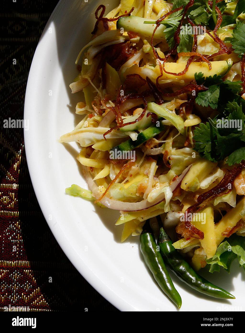 Mango salad--sweet and sour mango slices, shredded cucumber, onion ...