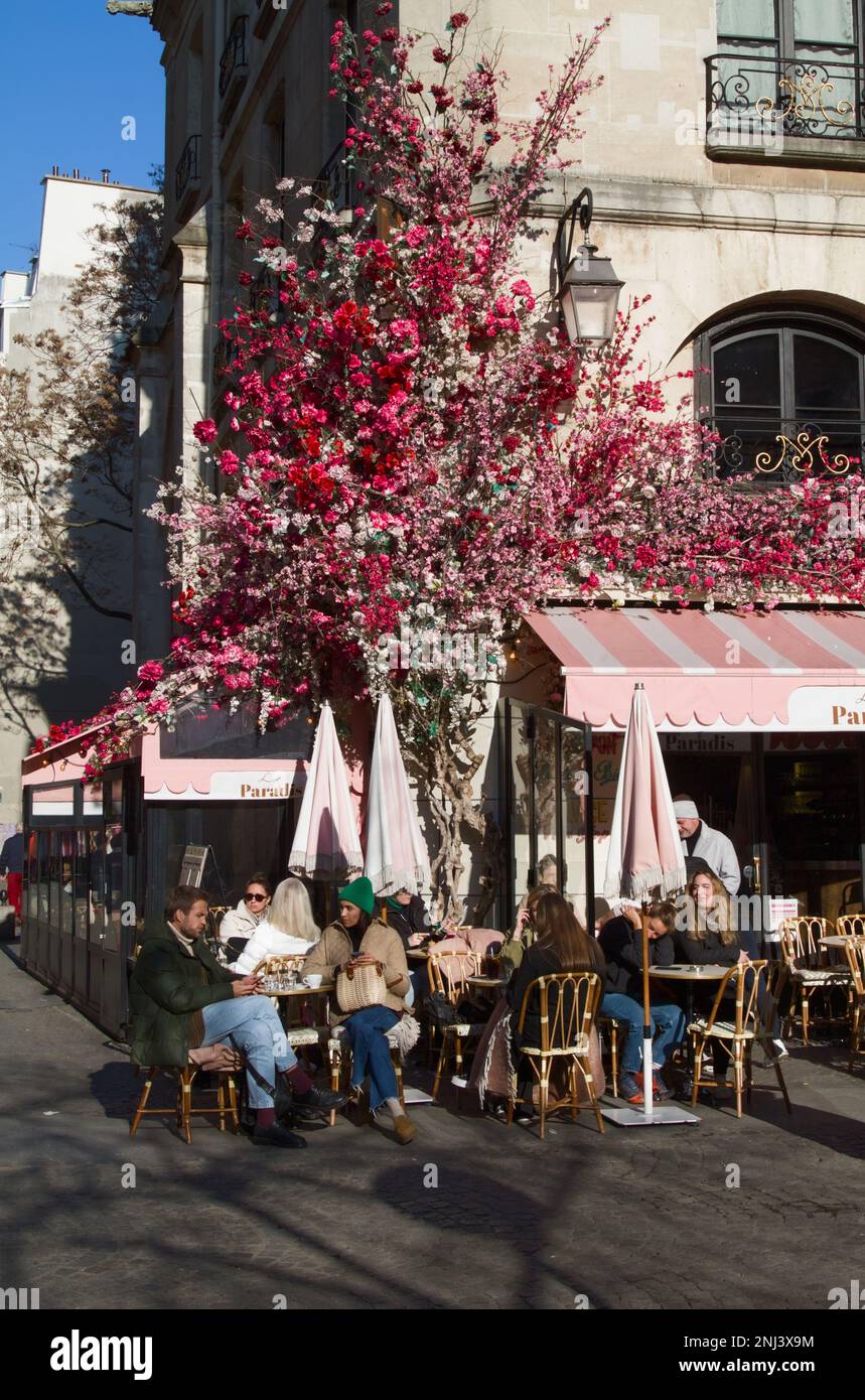 Street Scene Of People Drinking Coffee Outside A Cafe Decorated With ...