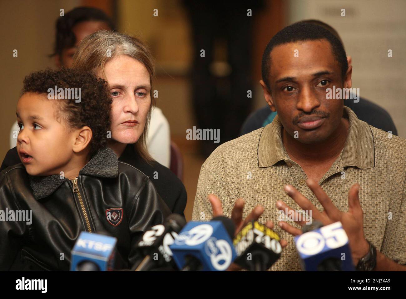 Charles Washington, right, talks on behalf of his family at the Asian ...