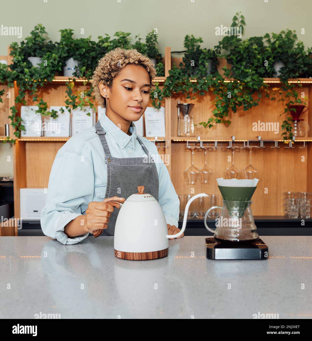 African coffee barista holding hi-res stock photography and images - Alamy