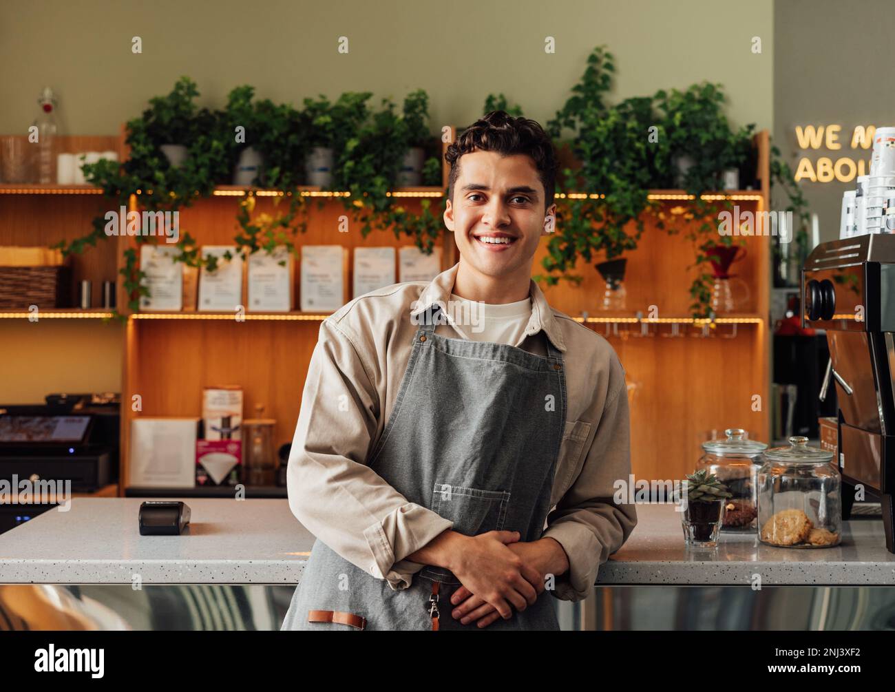 Portrait happy male barista hi-res stock photography and images - Alamy