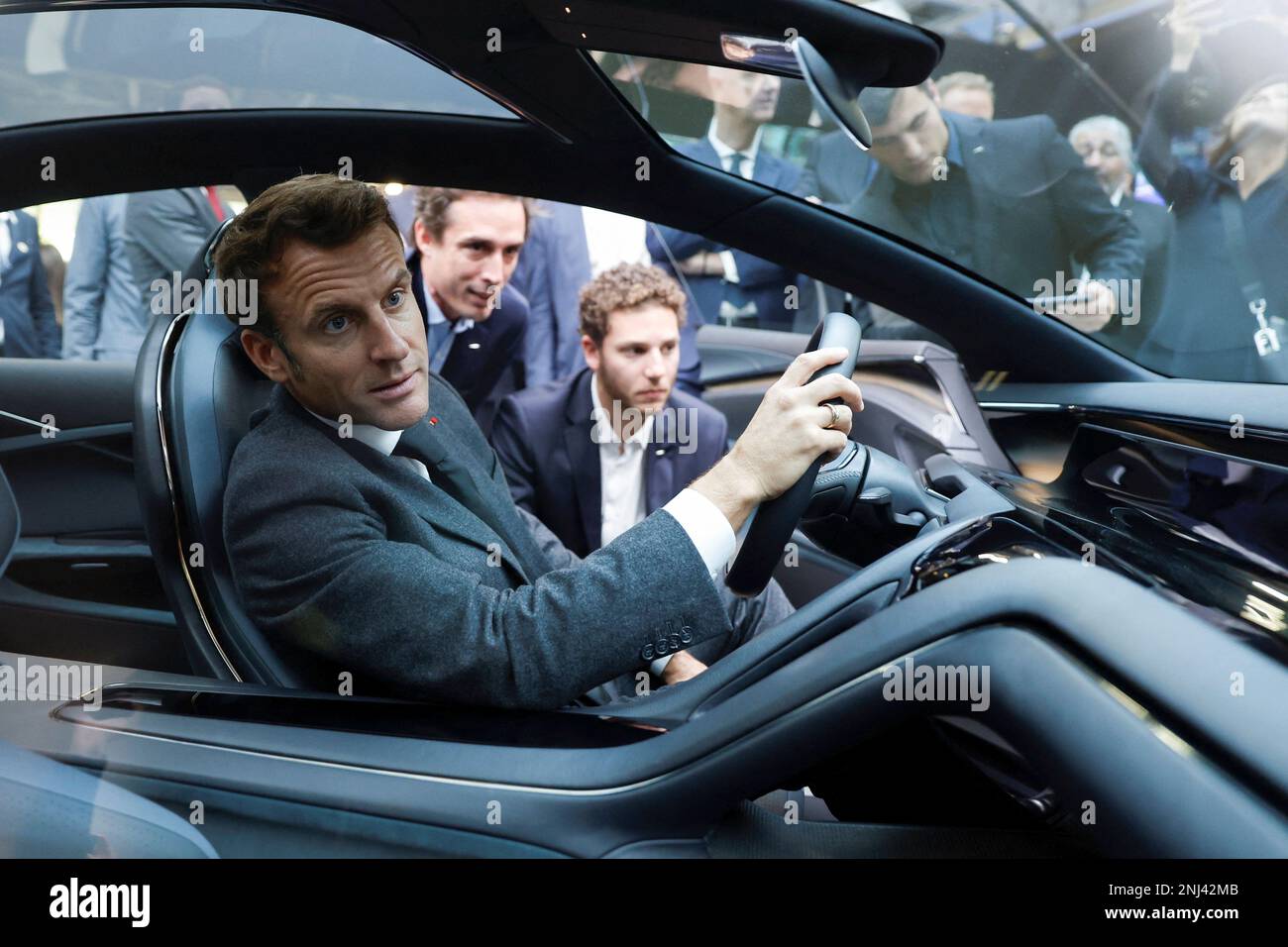 French President Emmanuel Macron sits inside the Hopium Machina Vision ...