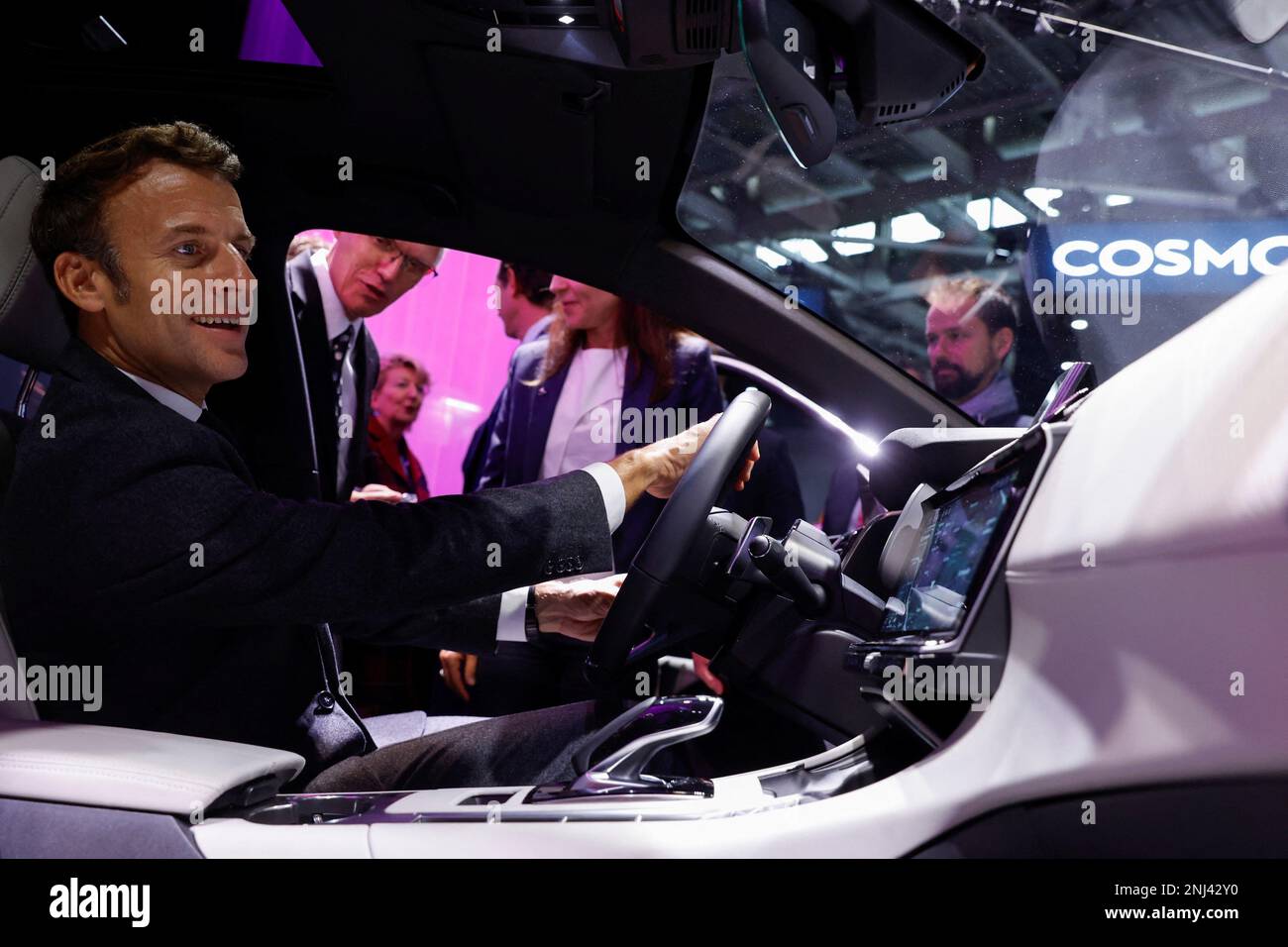 French President Emmanuel Macron sits inside a Peugeot DS 7 at the ...