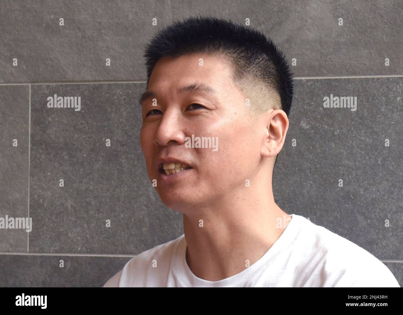 Japanese alpine skier Akira Sasaki speaks during an interview in Tokyo on October 17, 2022. 41 ...