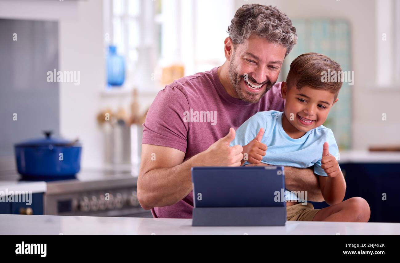 Dad son video call tablet hi-res stock photography and images - Alamy