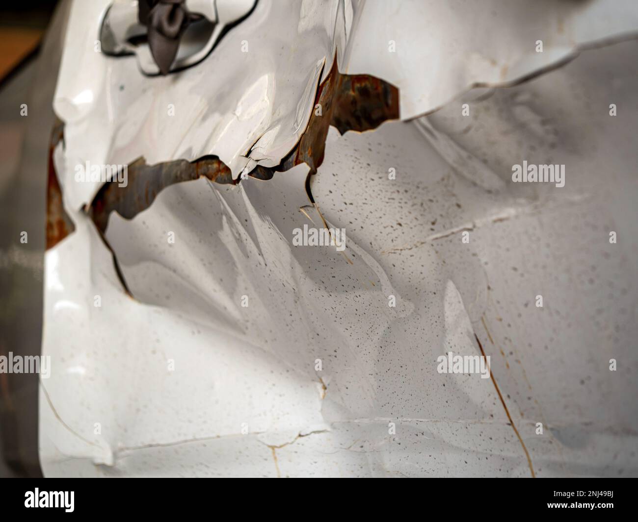 Parts of the car that were involved in the accident have dents and ...