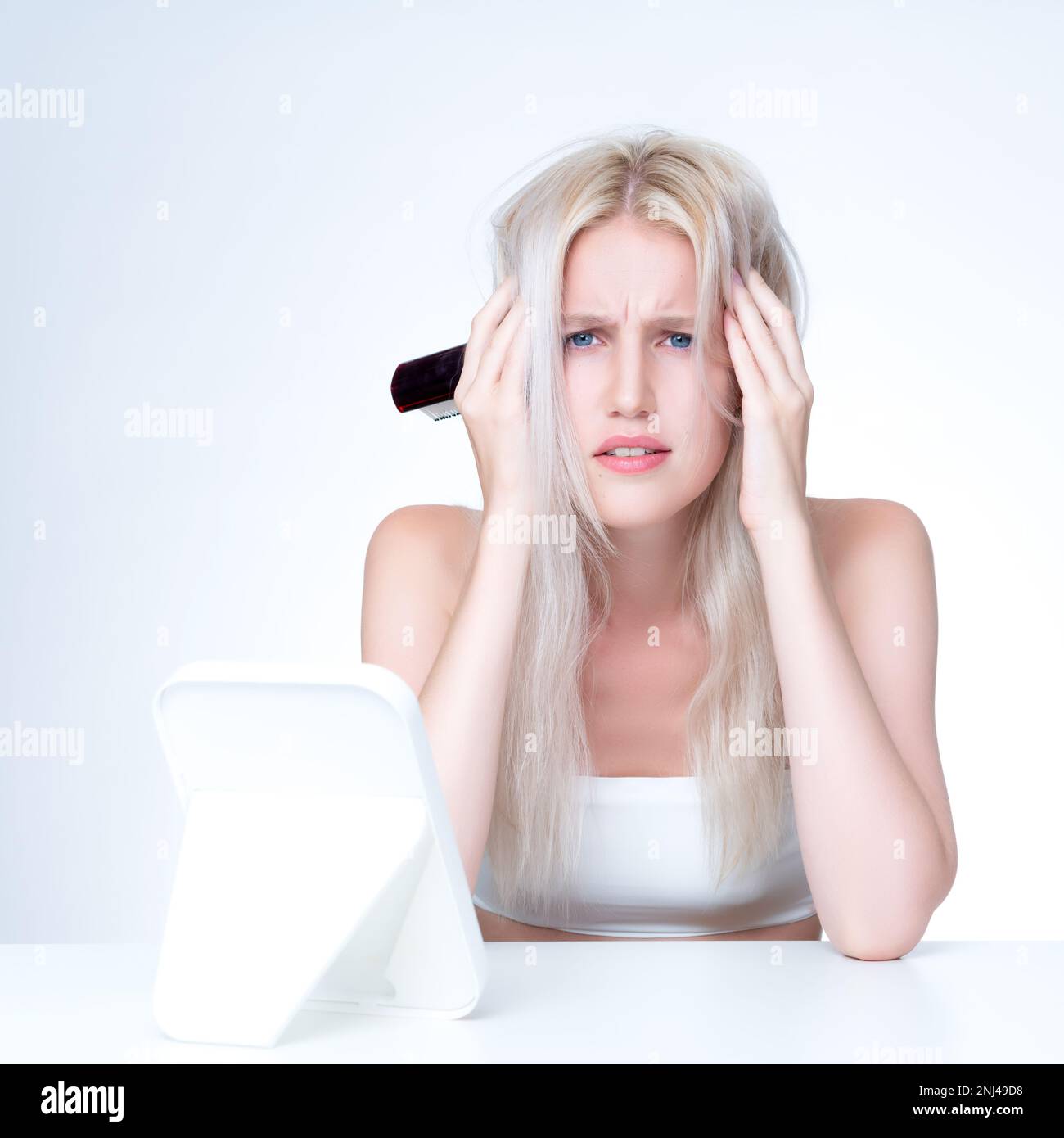 Female long blonde frizzy hair hi-res stock photography and images - Alamy