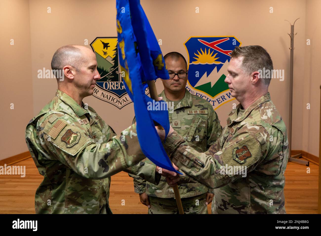 Lt. Col. Brian Kroeller assumes command of the 142nd AMXS during a ...