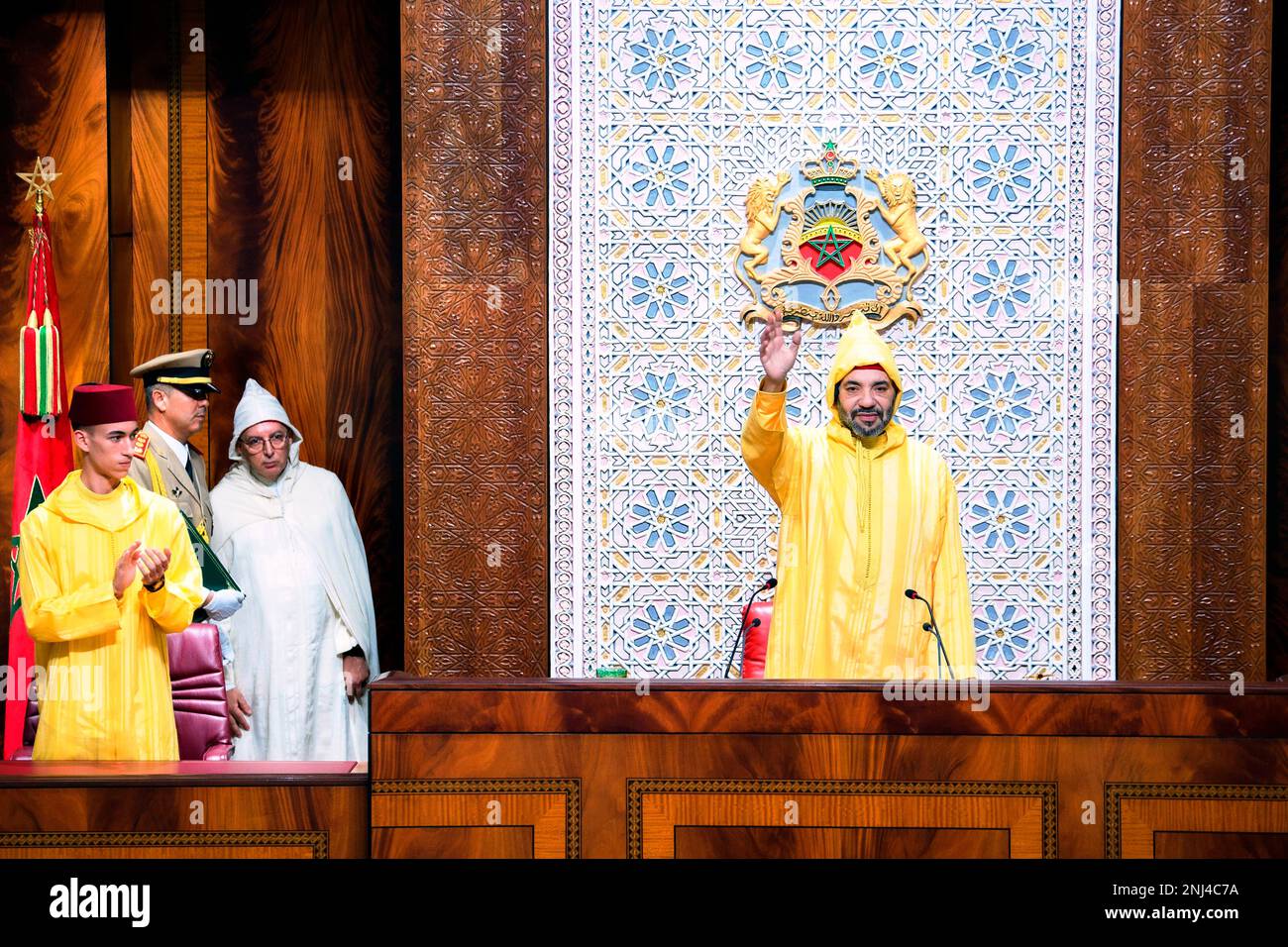 In this photo released by the Royal Palace, Moroccan King Mohammed VI, waves to parliamentarians ...