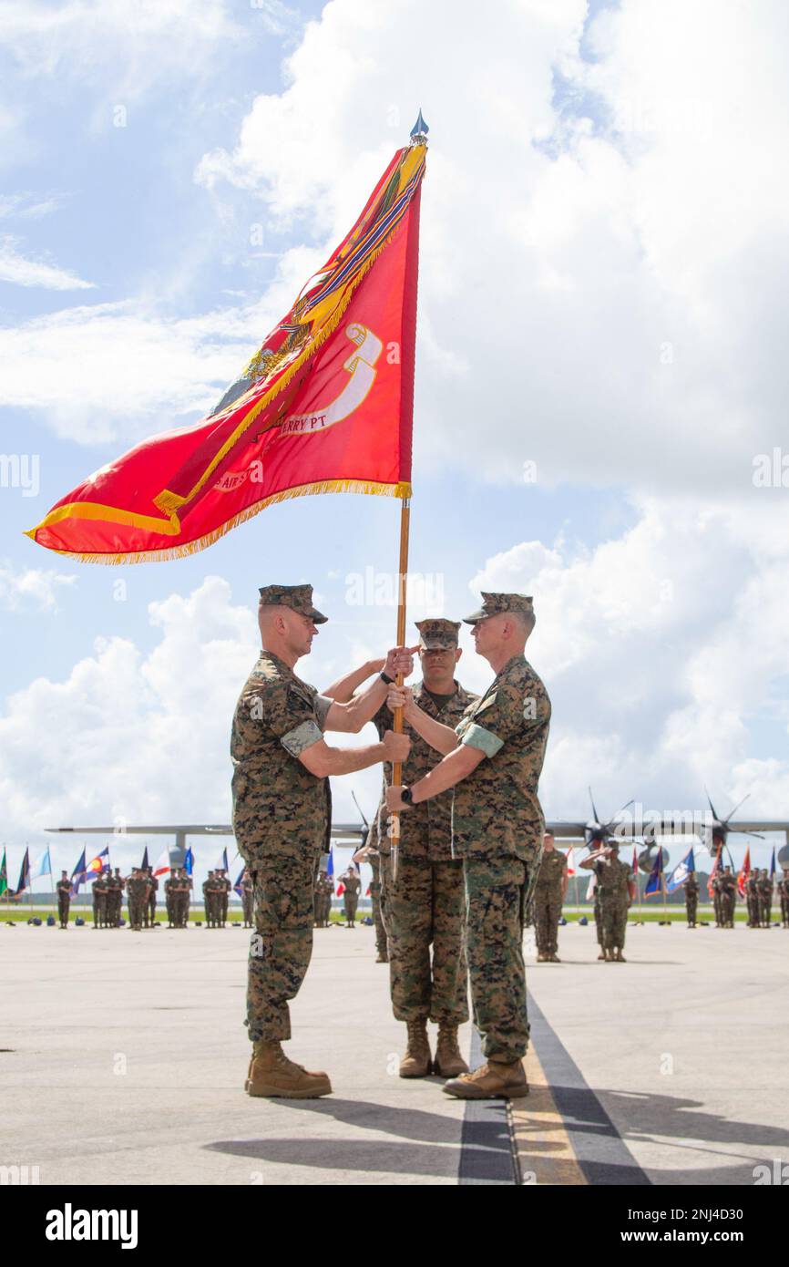 U.S. Marine Corps Col. Mikel R. Huber (right) passes the Marine Corps ...
