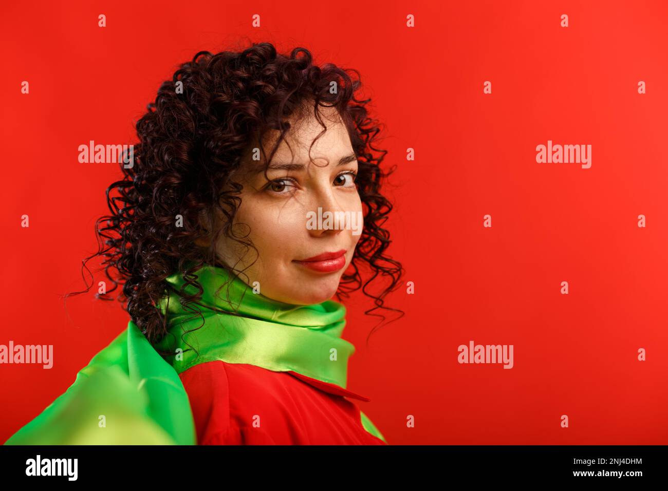 Close Up Portrait Of A Beautiful Young Woman With Dark Curly Hair A