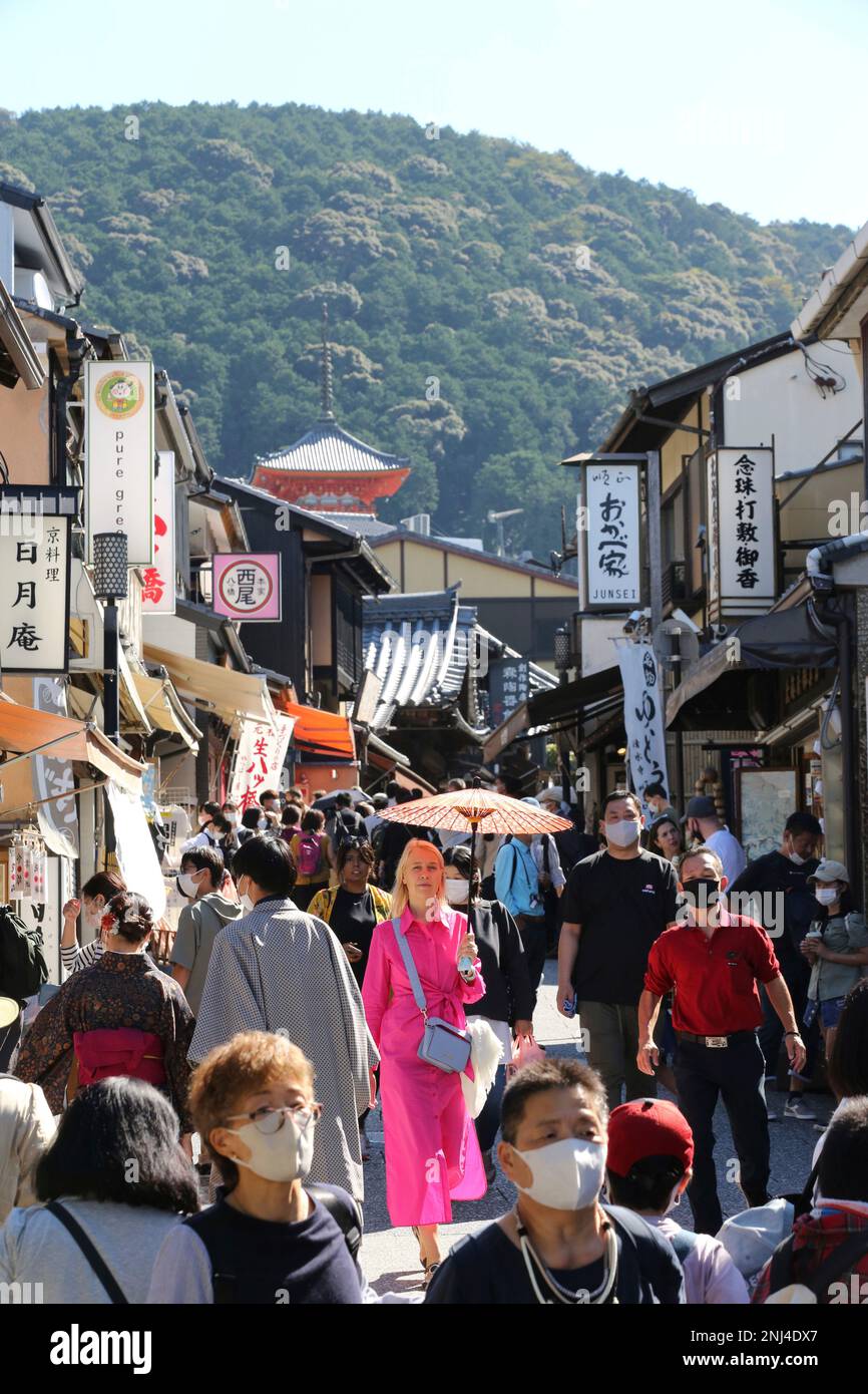 Foreign tourists are seen on a road to Kiyomizu-dera temple in Kyoto ...
