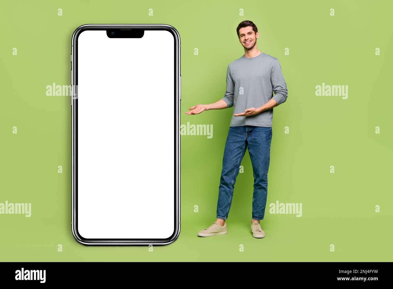 Full body photo of cheerful guy present you new phone model on long ...