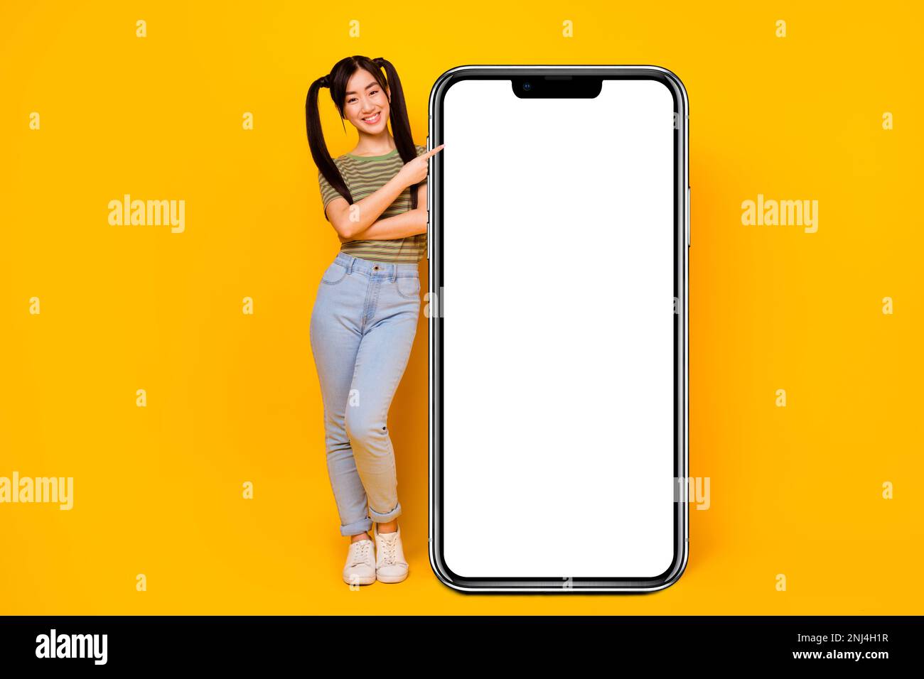 Full size photo of charming girl show huge phone display recommend new ... Full size photo of charming girl show huge phone display recommend new ...