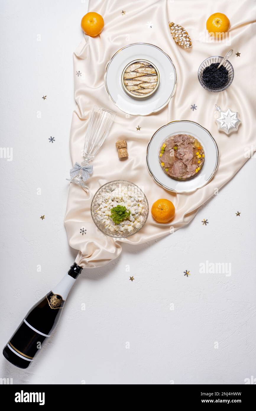 Soviet-style New Year's table with Olivier salad, meat and caviar. with ...