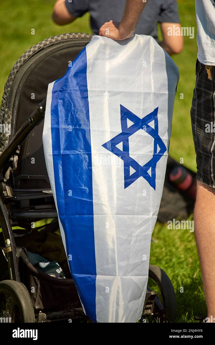 Toronto, Ontario Canada- May 29th, 2022: A stroller wearing the Israeli ...