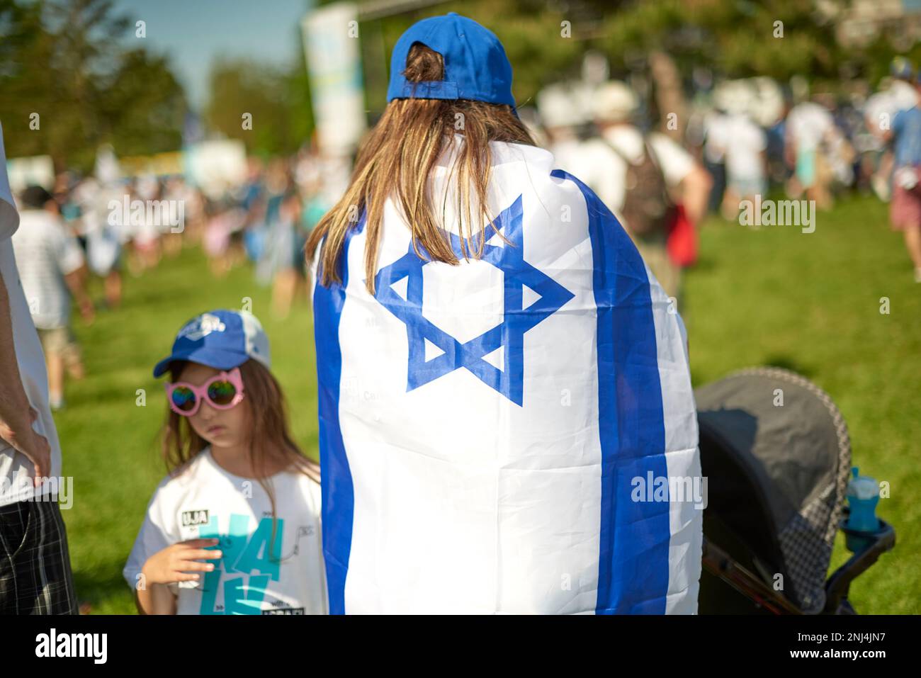 Toronto, Ontario Canada- May 29th, 2022: a mom wearing the Israeli flag ...