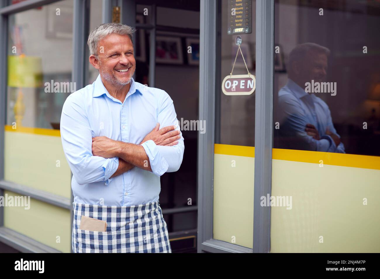 Portrait Of Male Owner Or Staff Standing Outside Coffee Shop Stock ...
