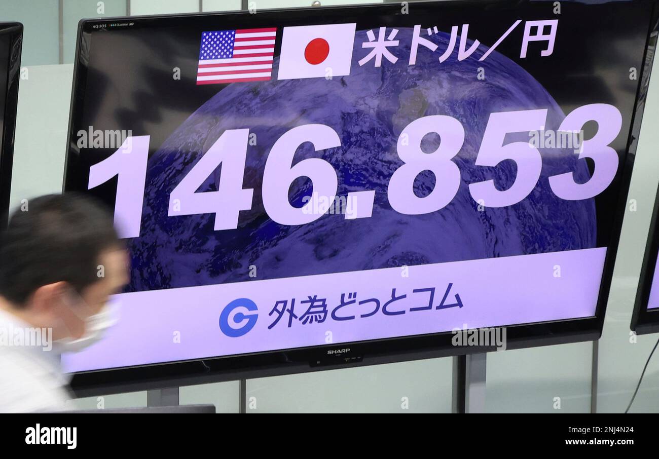 A monitor shows exchange rate of the Japanese yen against the U.S ...