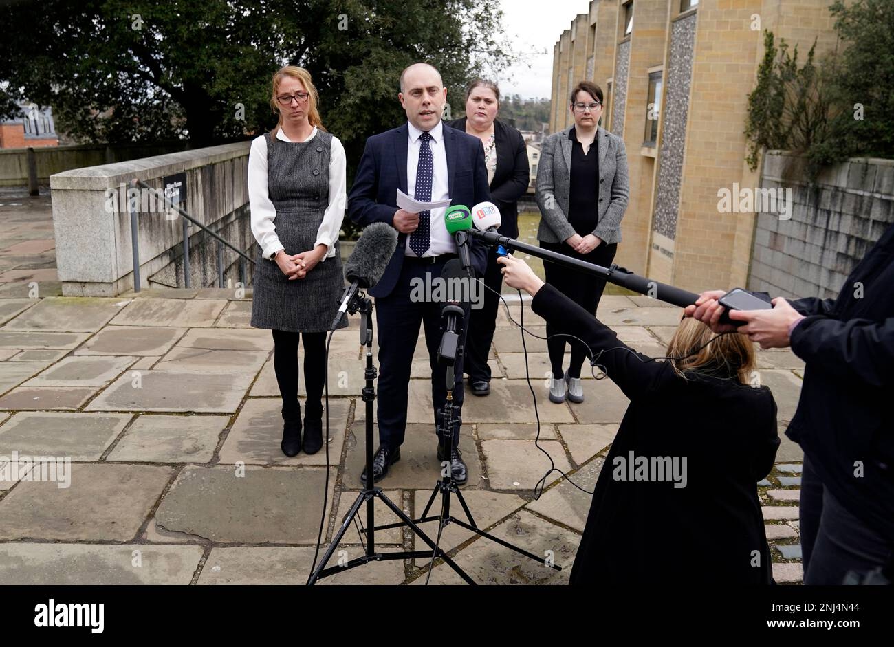 Hampshire Constabulary's DCI Rod Kenny (2nd left) reads a statement to ...