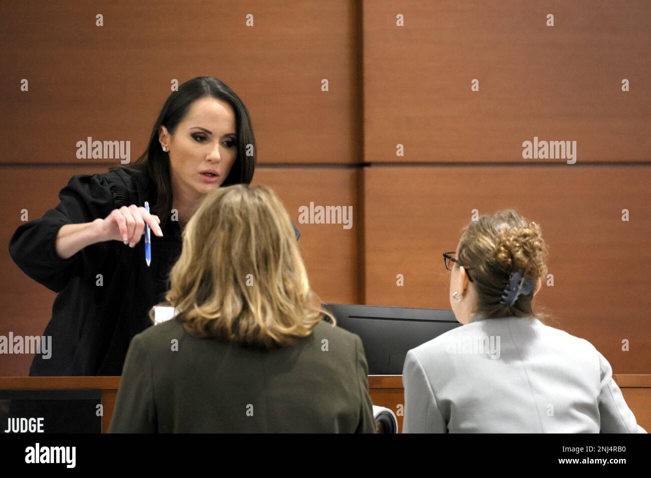 Judge Elizabeth Scherer speaks with assistant state attorney Carolyn ...