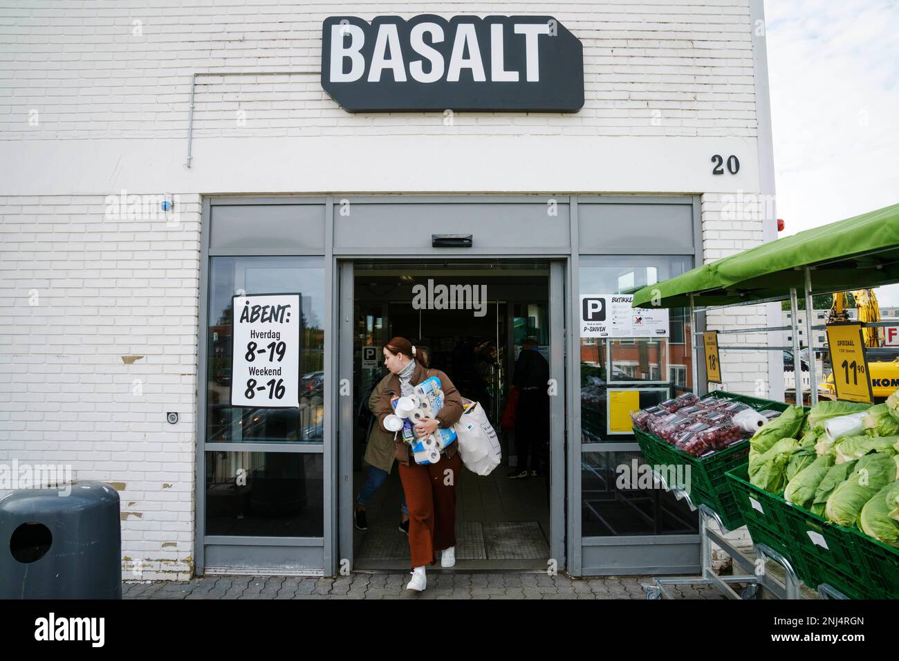 A woman leaves the low-price supermarket Basalt opened in Aarhus ...