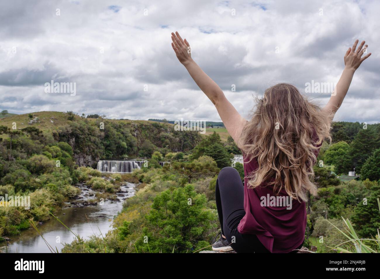 woman with raised up hands enjoying beautiful nature landscape Stock ...