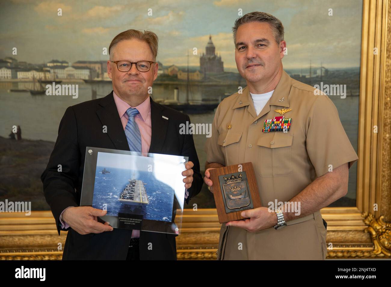Mr. Juhana Vartiainen, Mayor of Helsinki, left, and U.S. Navy Capt ...