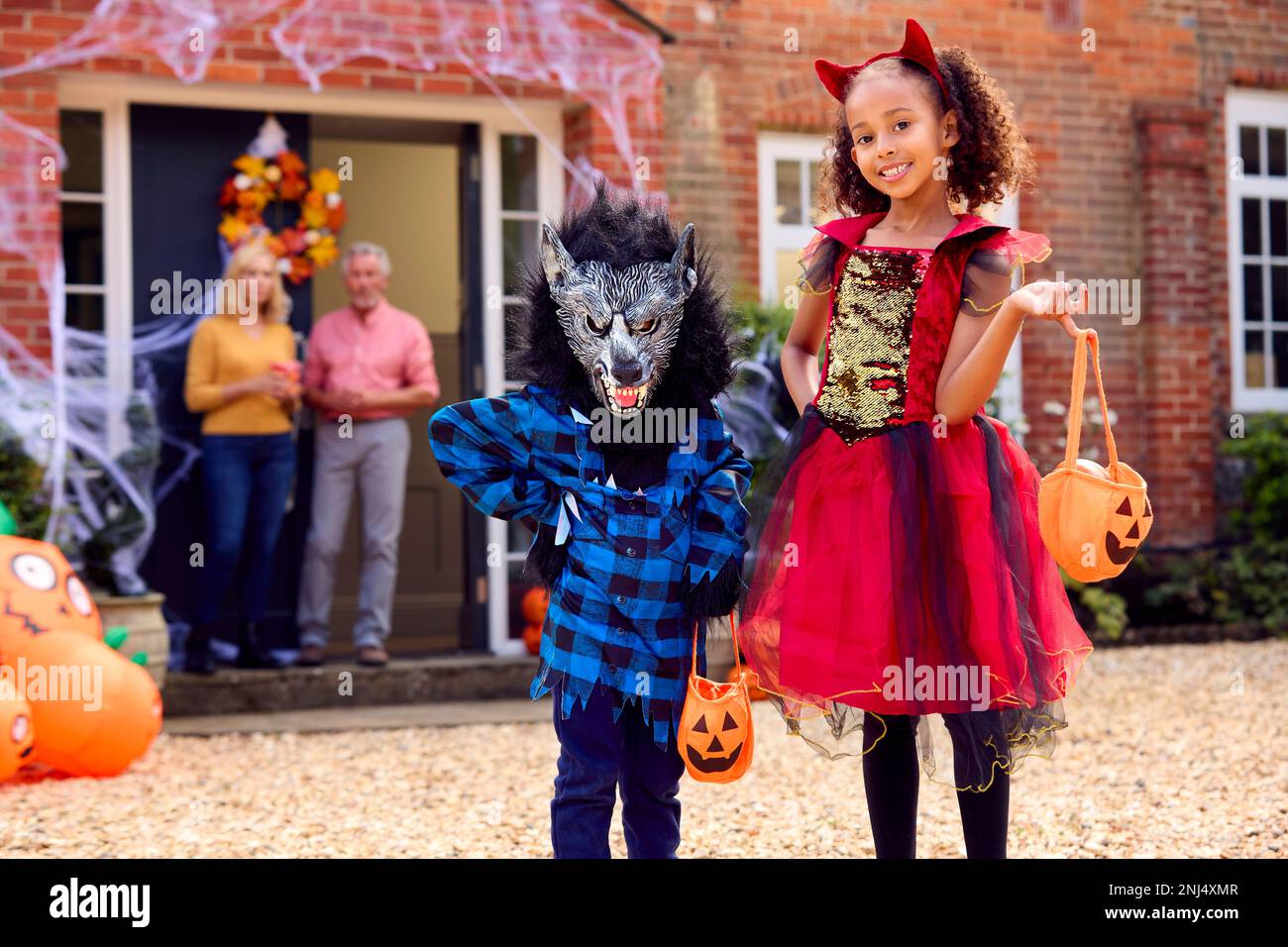 Portrait Of Grandchildren Dressing Up To Visit Grandparent's House ...