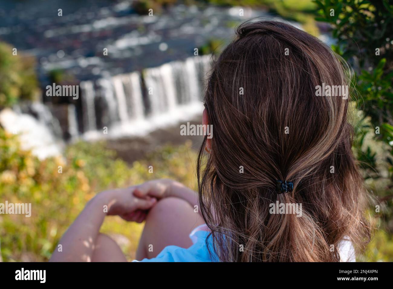 Rear view woman looking waterfall hi-res stock photography and images ...