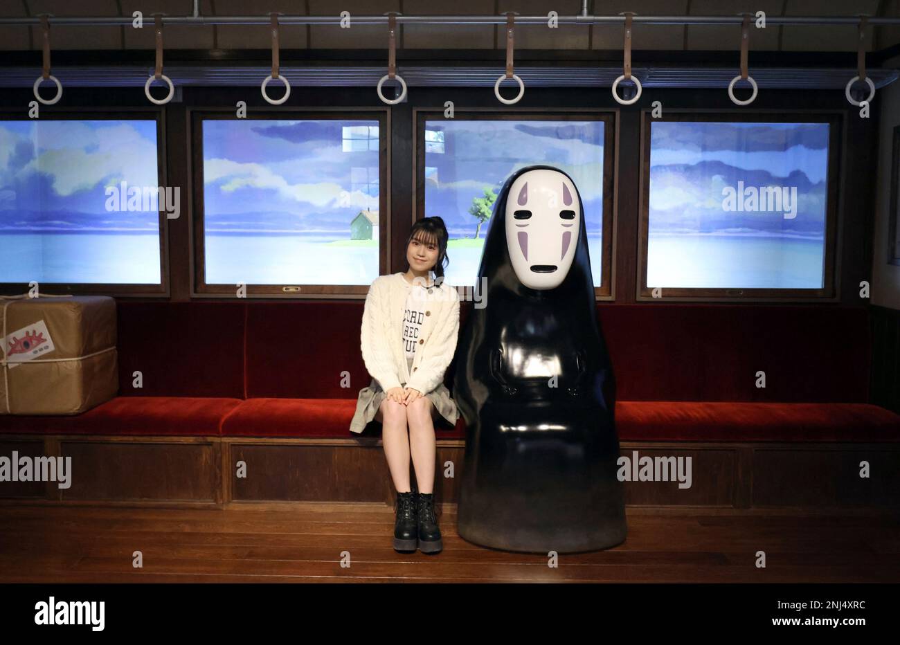 A girl poses with Kaonashi, No-Face a character in the film, Spirited ...