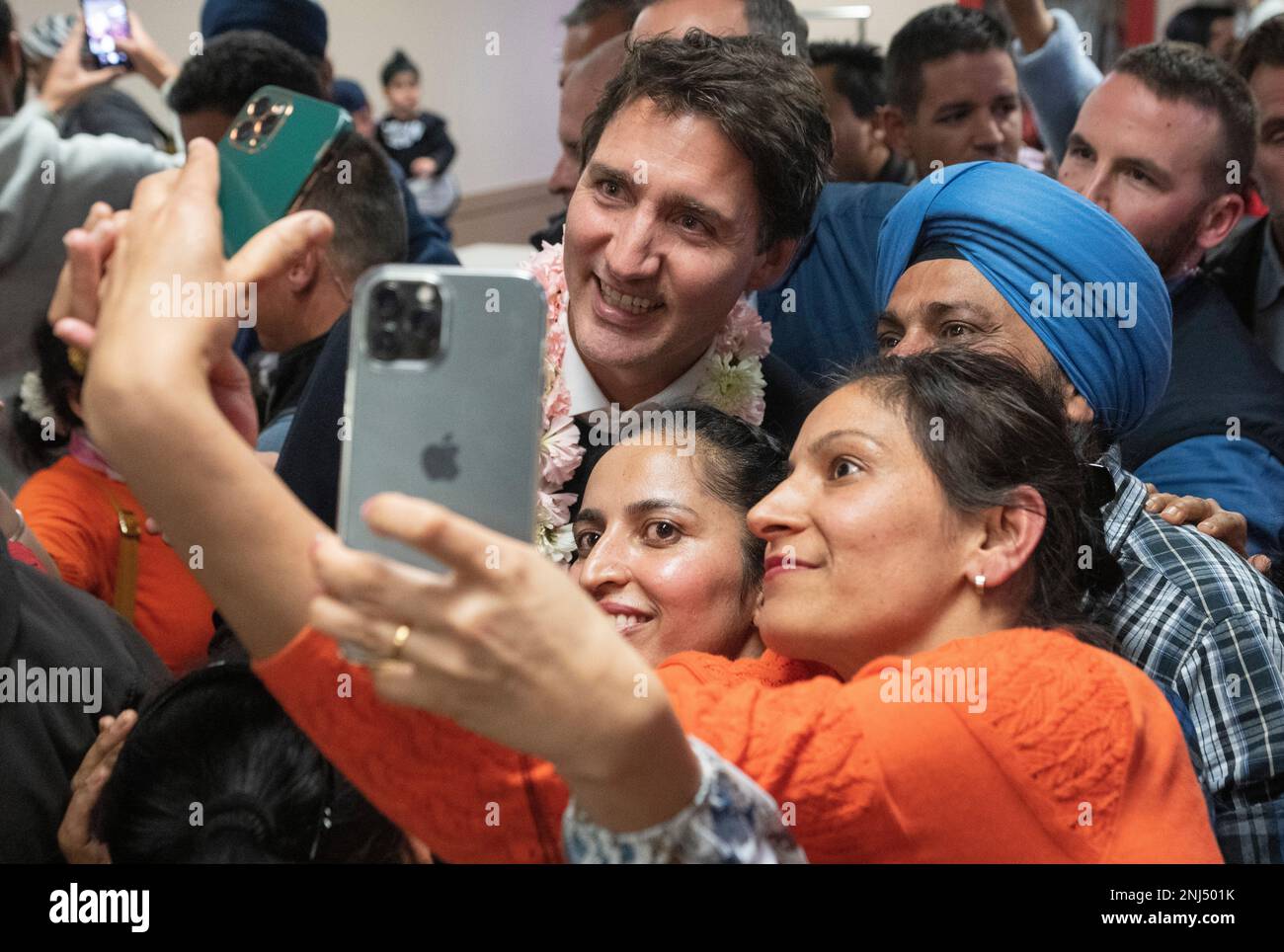 Canadian Prime Minister Justin Trudeau poses for photos as he makes his ...