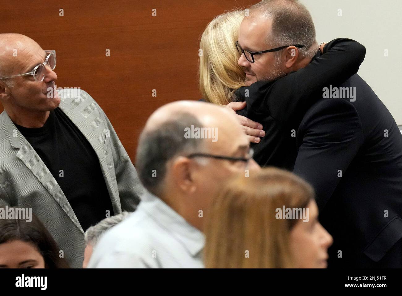 Ryan Petty hugs Annika Dworet, shown with her husband, Mitch Dworet ...