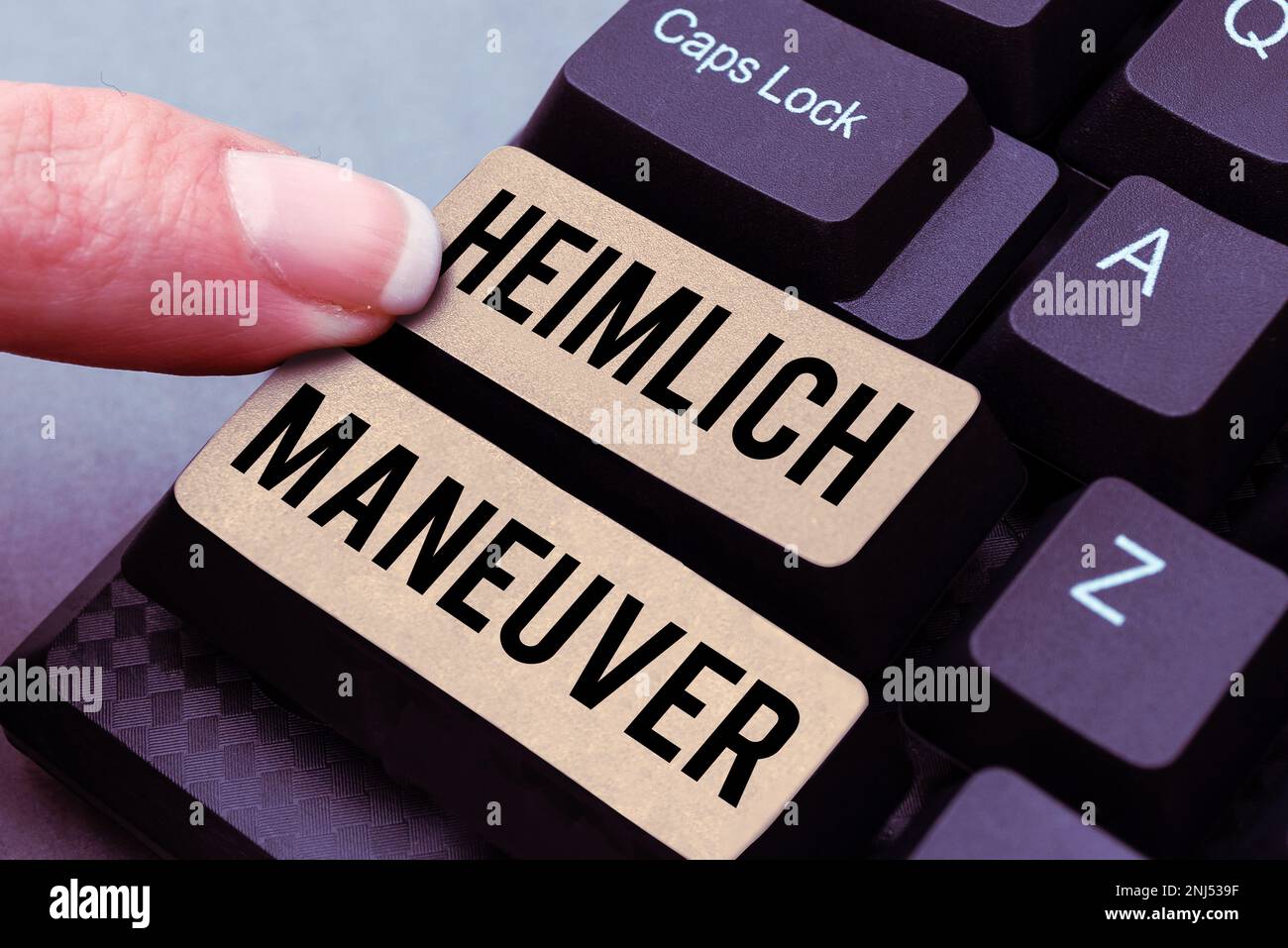 Hand writing sign Heimlich Maneuver, Word Written on application of ...
