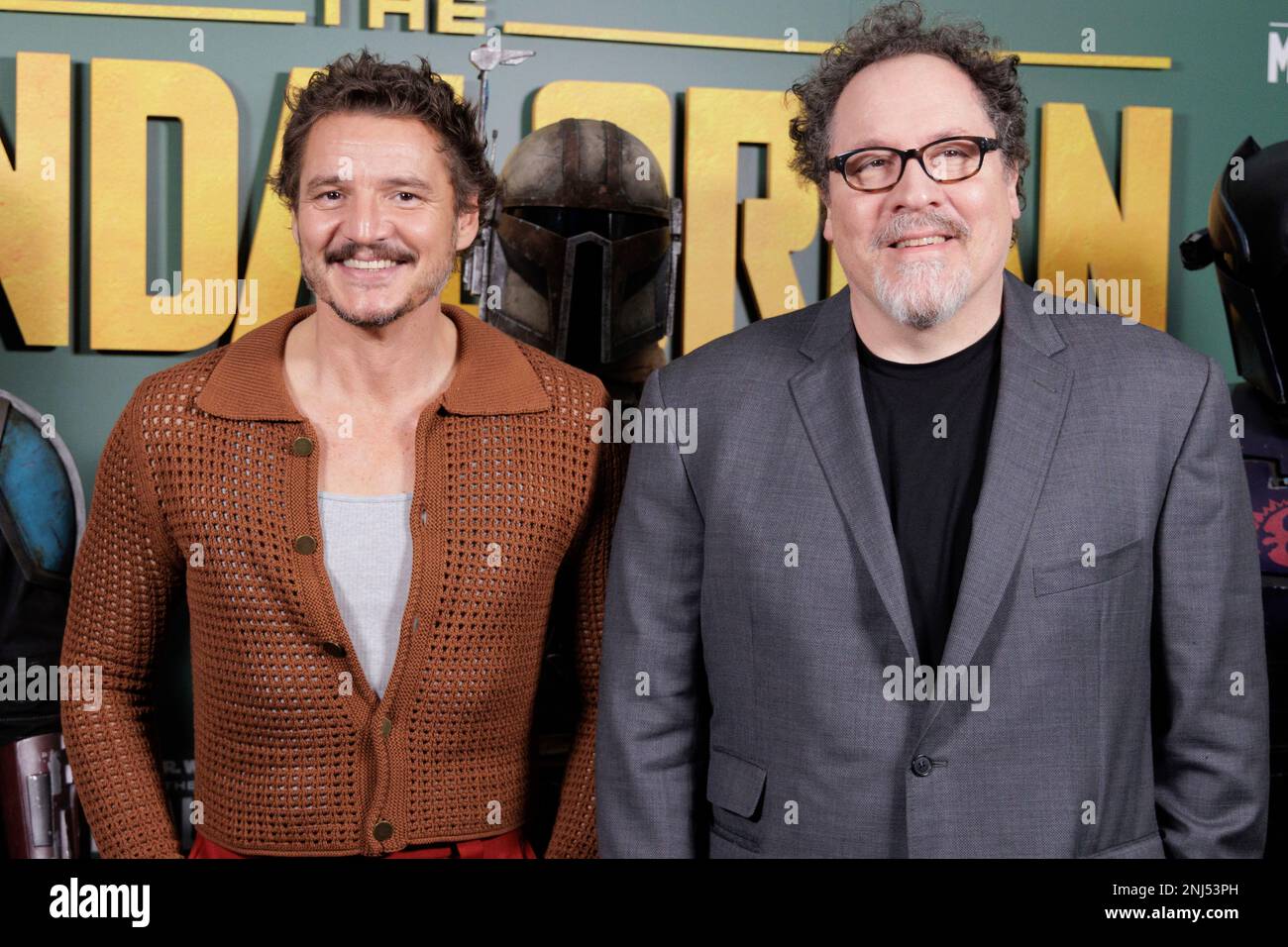 Pedro Pascal, left, and Jon Favreau pose for photographers during a ...