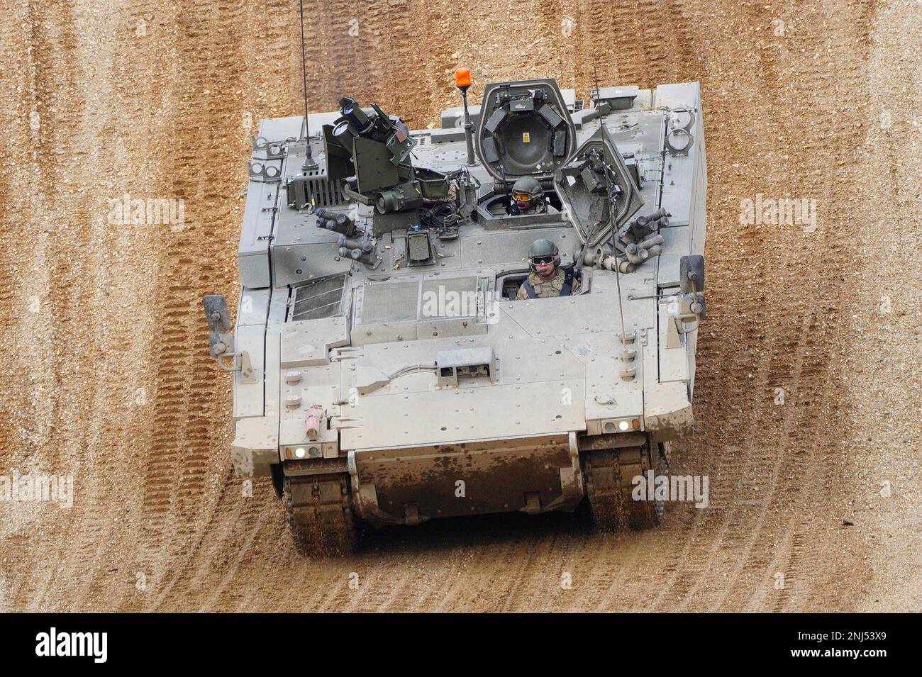 An Ajax Ares tank, an armored personnel carrier, is driven on the ...