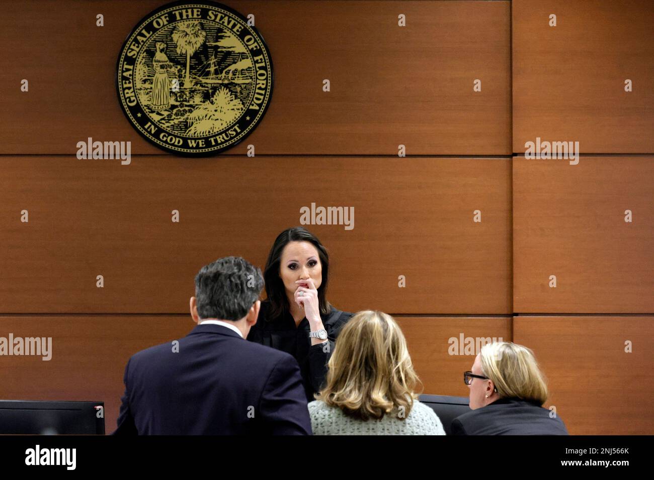 Judge Elizabeth Scherer speaks to, from left; Assistant State Attorneys ...