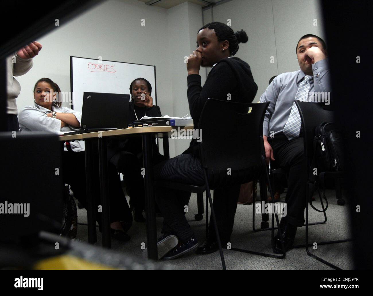 Marcus Colina teaching information technology to students at Year Up in ...