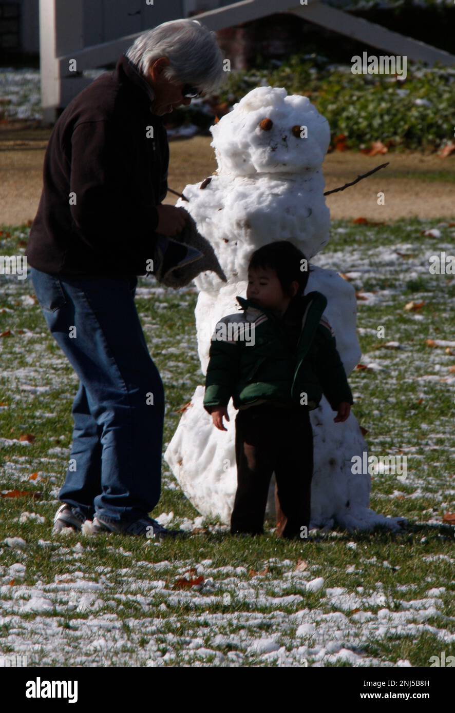 Albert Wong brings his grandson Kai Cobain, 22 months old, to see snow ...
