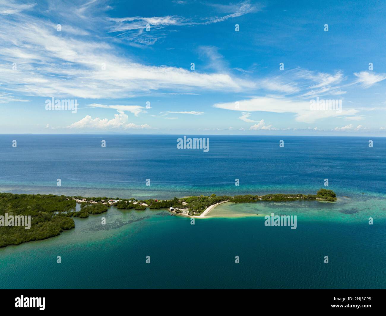 Shore of the island with the beach and blue sea.Turtle Islands, Negros ...