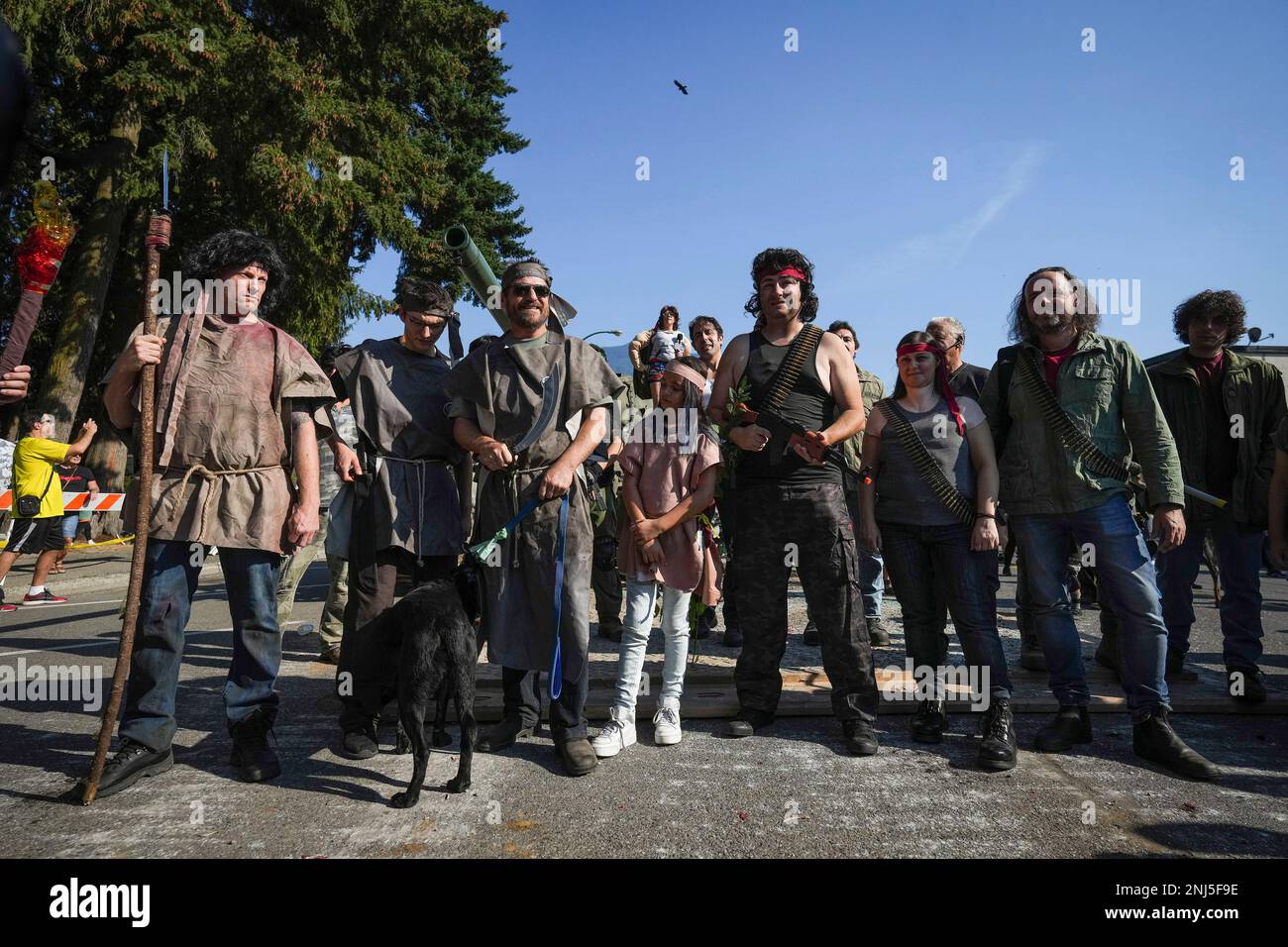 People dressed as the movie character John Rambo line up to be judged ...