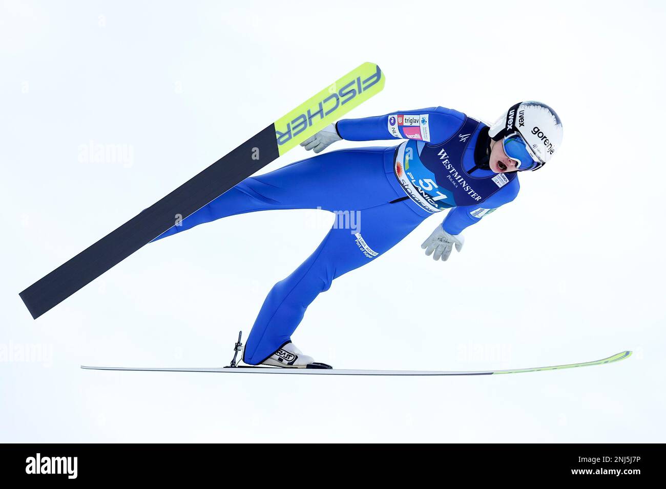 Nika Kriznar of Slovenia soars through the air during a ski jumping ...